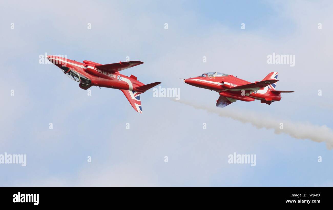 Two BAE Systems Hawk T1 jets form the Red Arrows aerobatic team flying ...