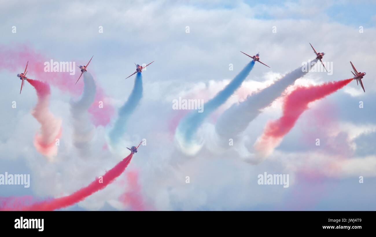 Red Arrows producing colorful smoke trails at Shuttleworth Stock Photo ...