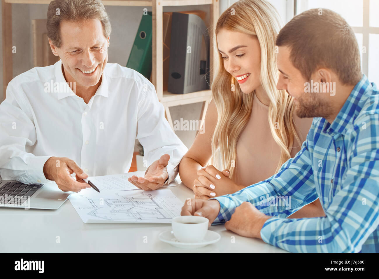 Young couple rent apartment together in the office layout Stock Photo ...