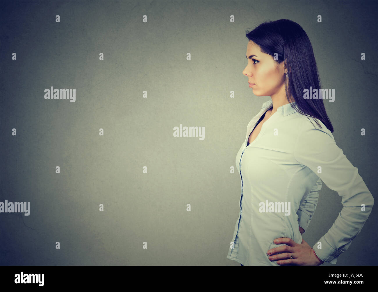 Side profile of a serious woman Stock Photo - Alamy