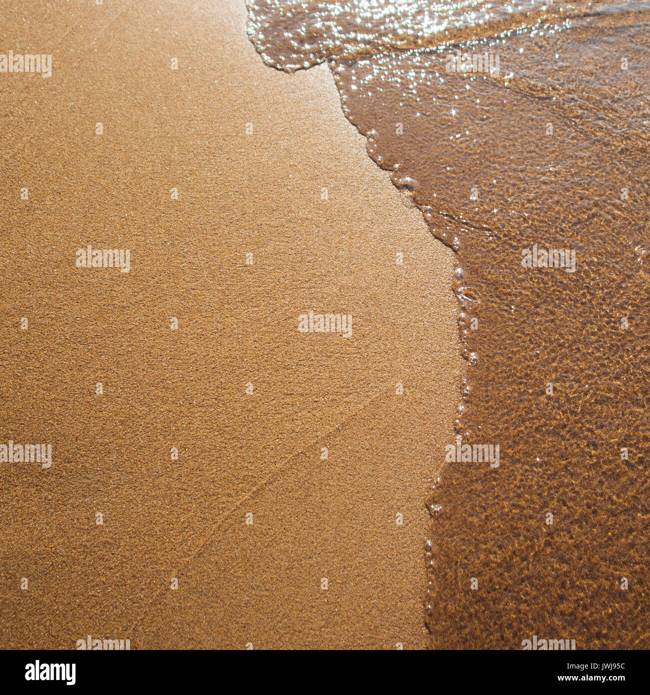 Water on sand Stock Photo - Alamy