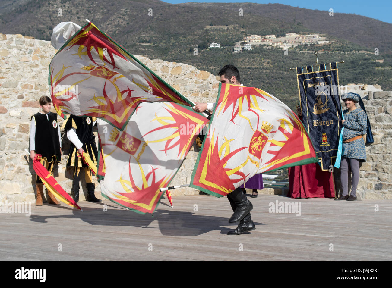 Flag throwing during medieval festival in the historic city of Taggia ...