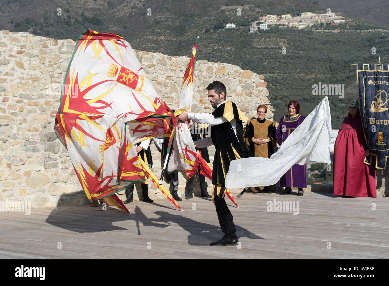 Flag throwing during medieval festival in the historic city of Taggia ...