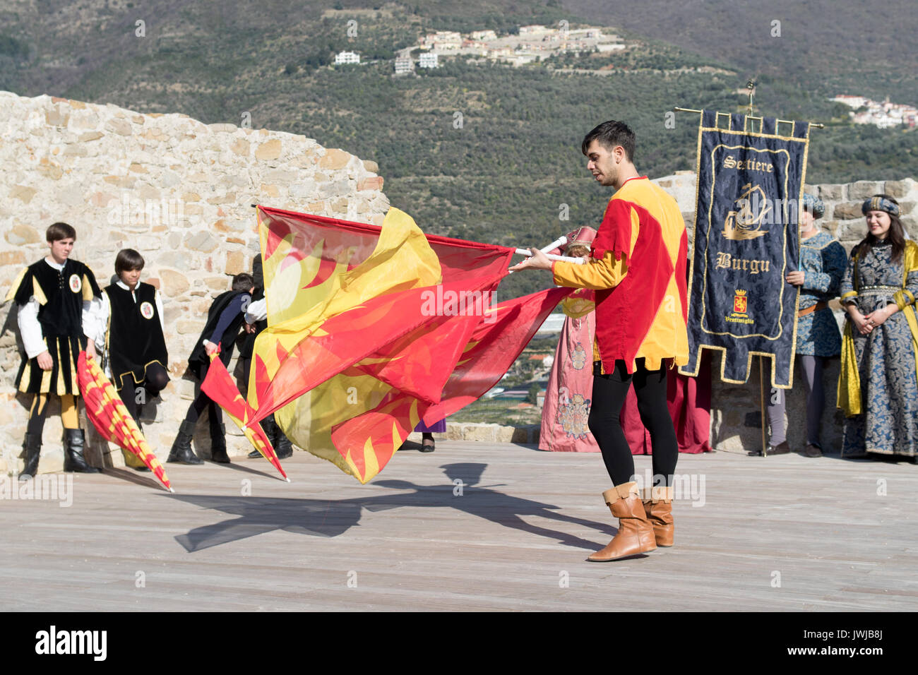 Flag throwing during medieval festival in the historic city of Taggia ...