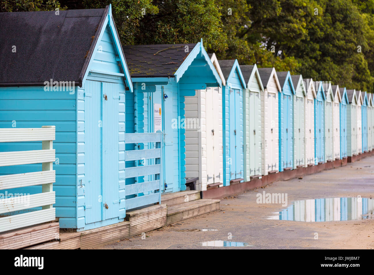 Colourful Beach Huts, invarious shades of Blue Stock Photo - Alamy
