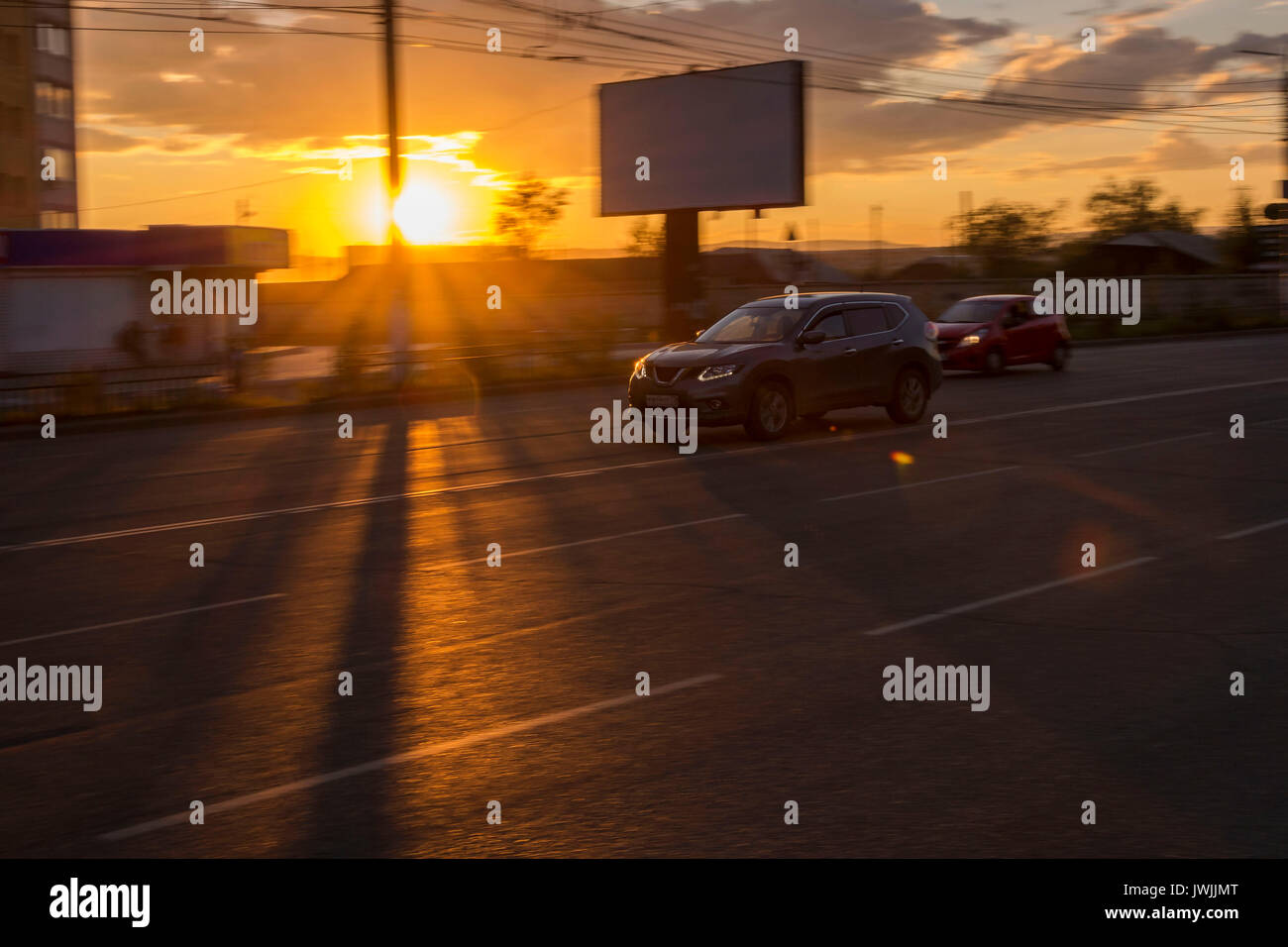 Photography from a moving car at slow shutter speeds. Blurred ...