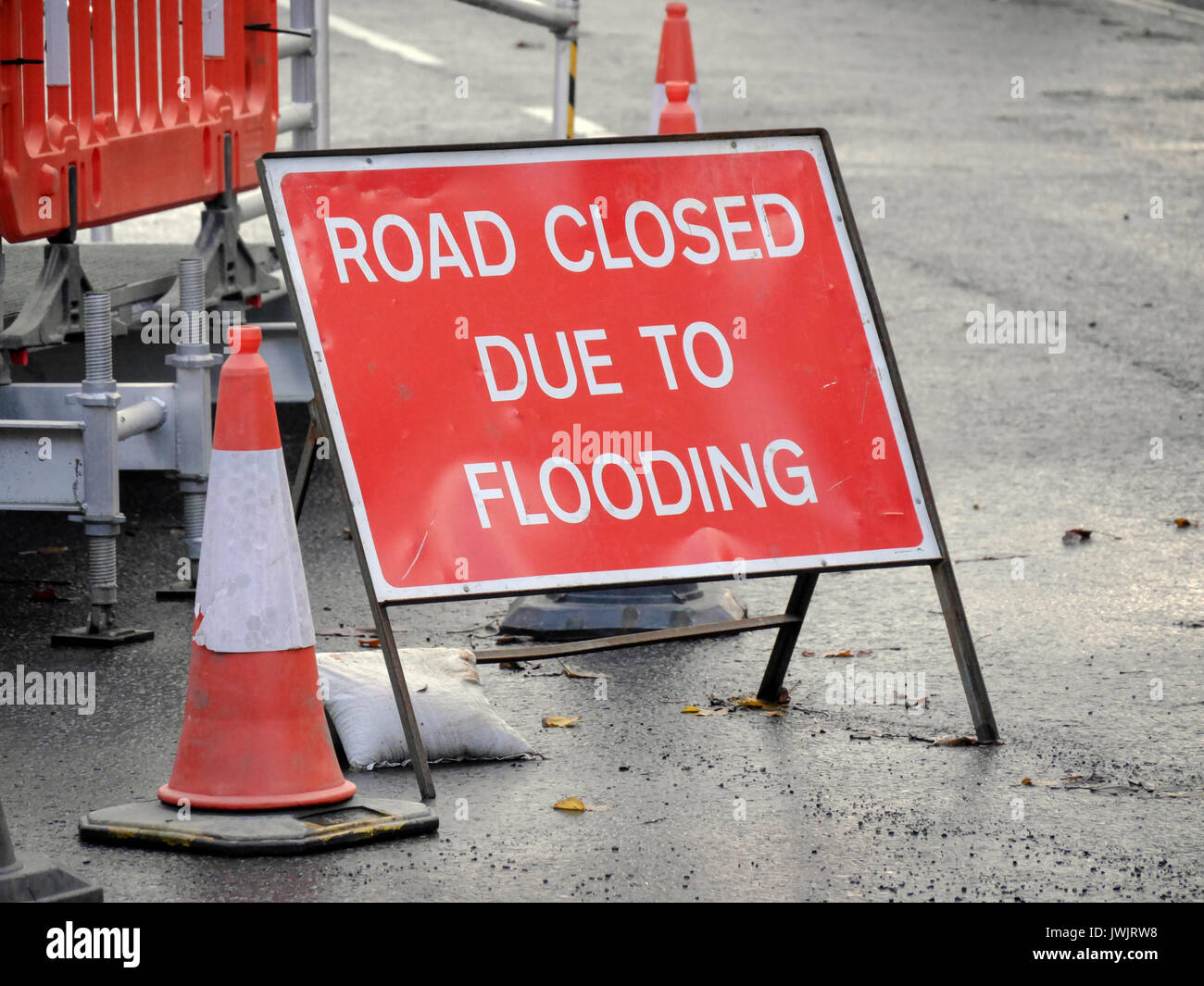 Closeup of Road Closed sign after flooding in city street Stock Photo ...