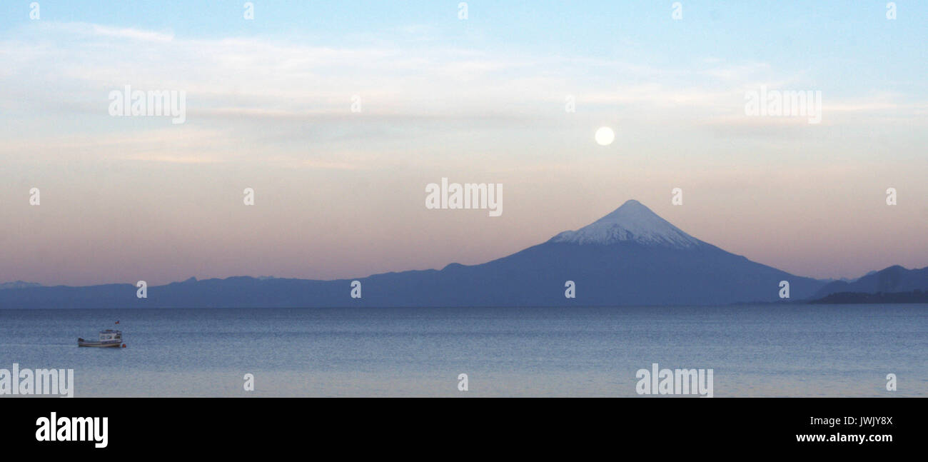 Full Moon Behind the Volcano Stock Photo - Alamy