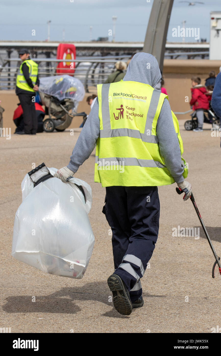 Blackpool Council employee picking street litter on the town centre ...