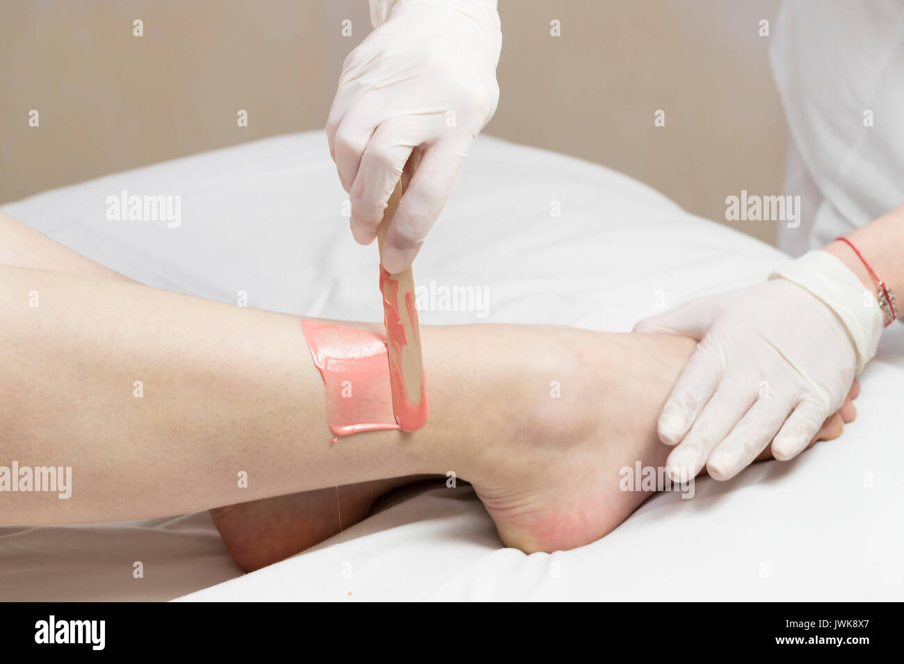 Process depilation female legs and hands in a beauty salon Stock Photo ...