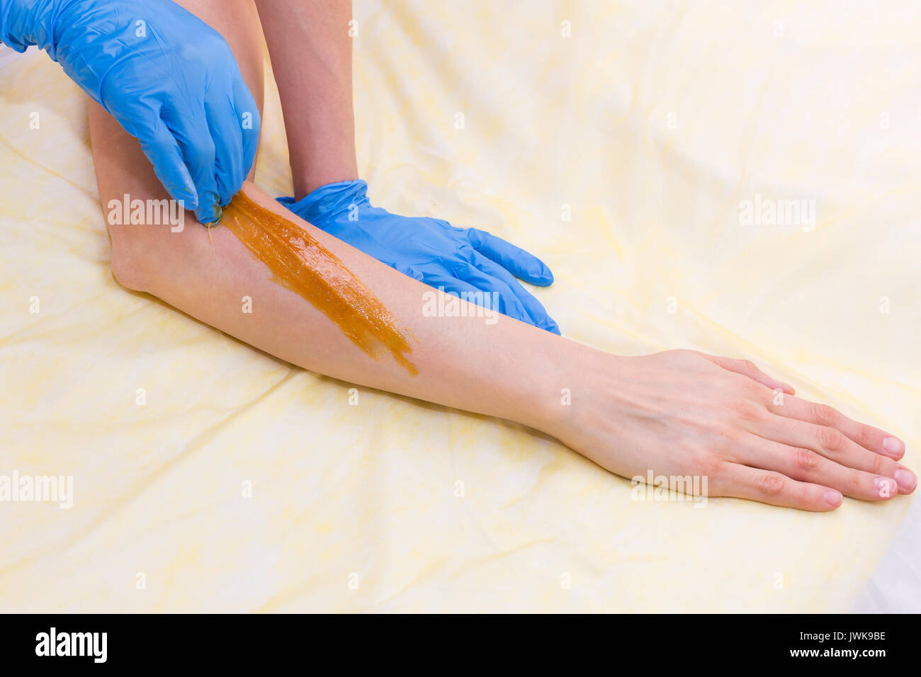 Epilation sugar processes woman passes hi-res stock photography and ...