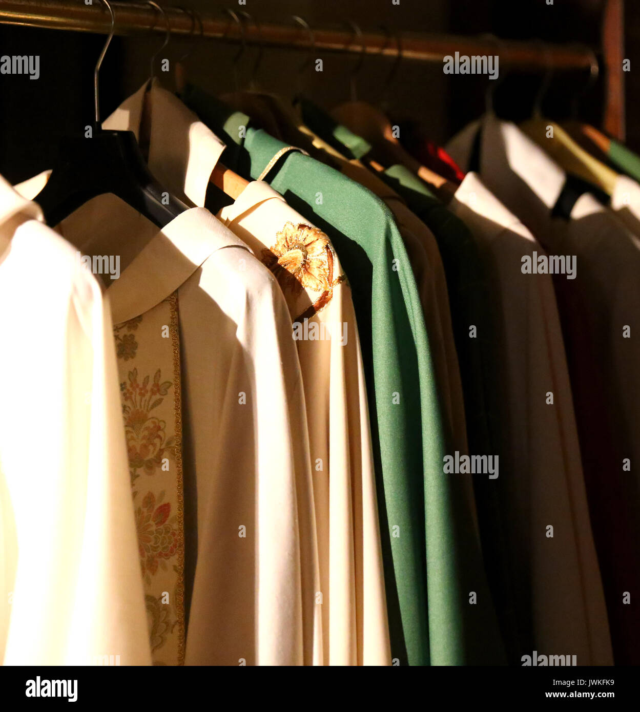 Many dresses for dressing priests in the sacristy of an ancient church ...