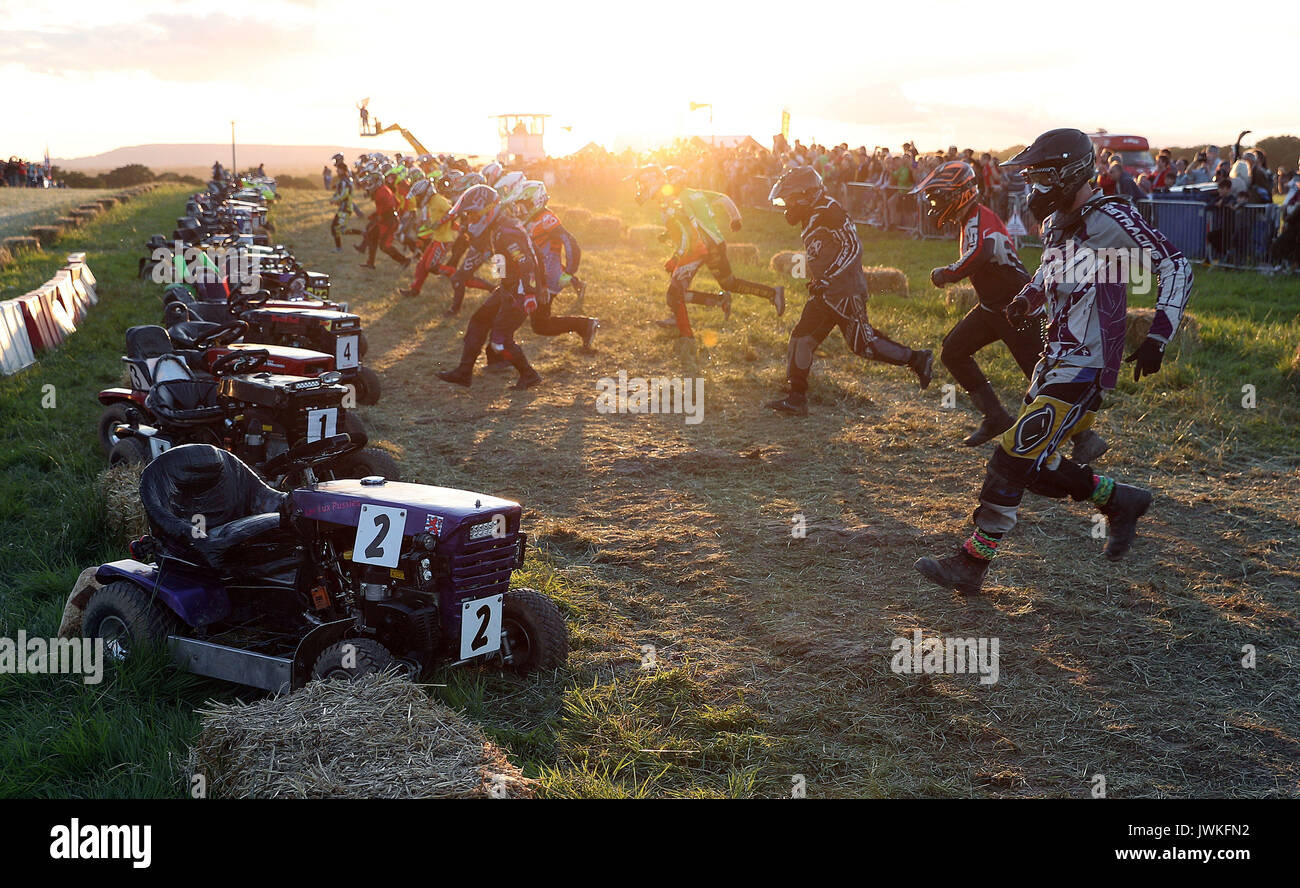 Competitors take part in a 'Le Mans' style mass start as the flag is ...
