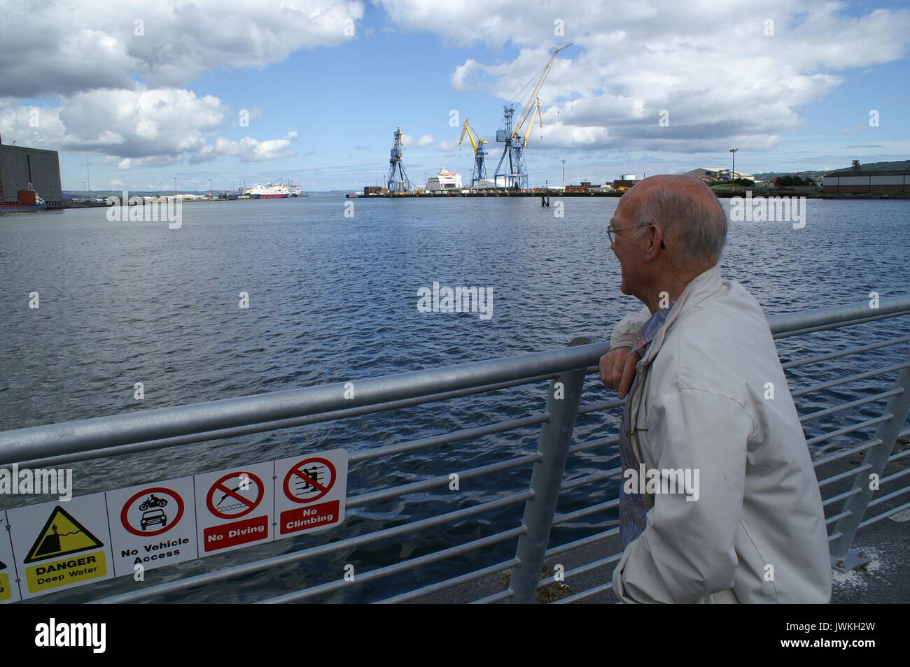 old riveter looking out at Belfast Harbour Stock Photo - Alamy