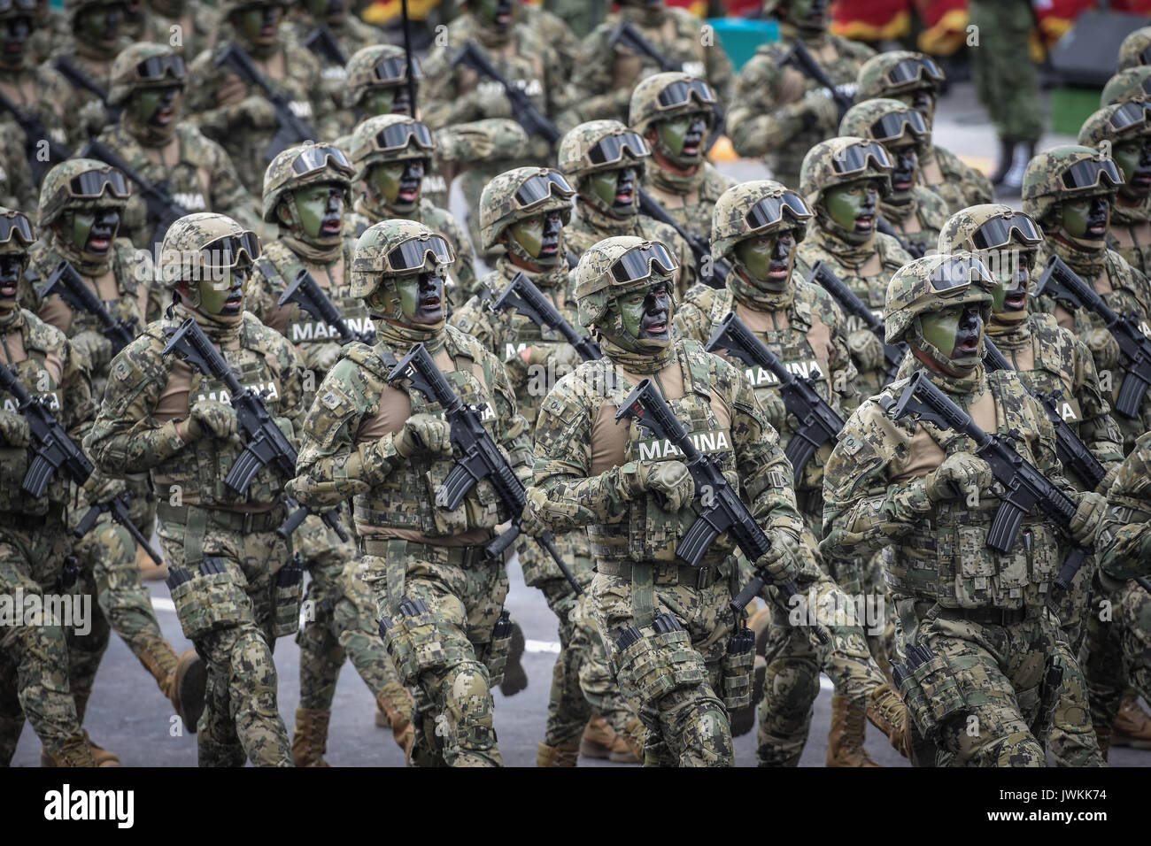 Members of the Marine Corps and Soldiers march during a military parade ...