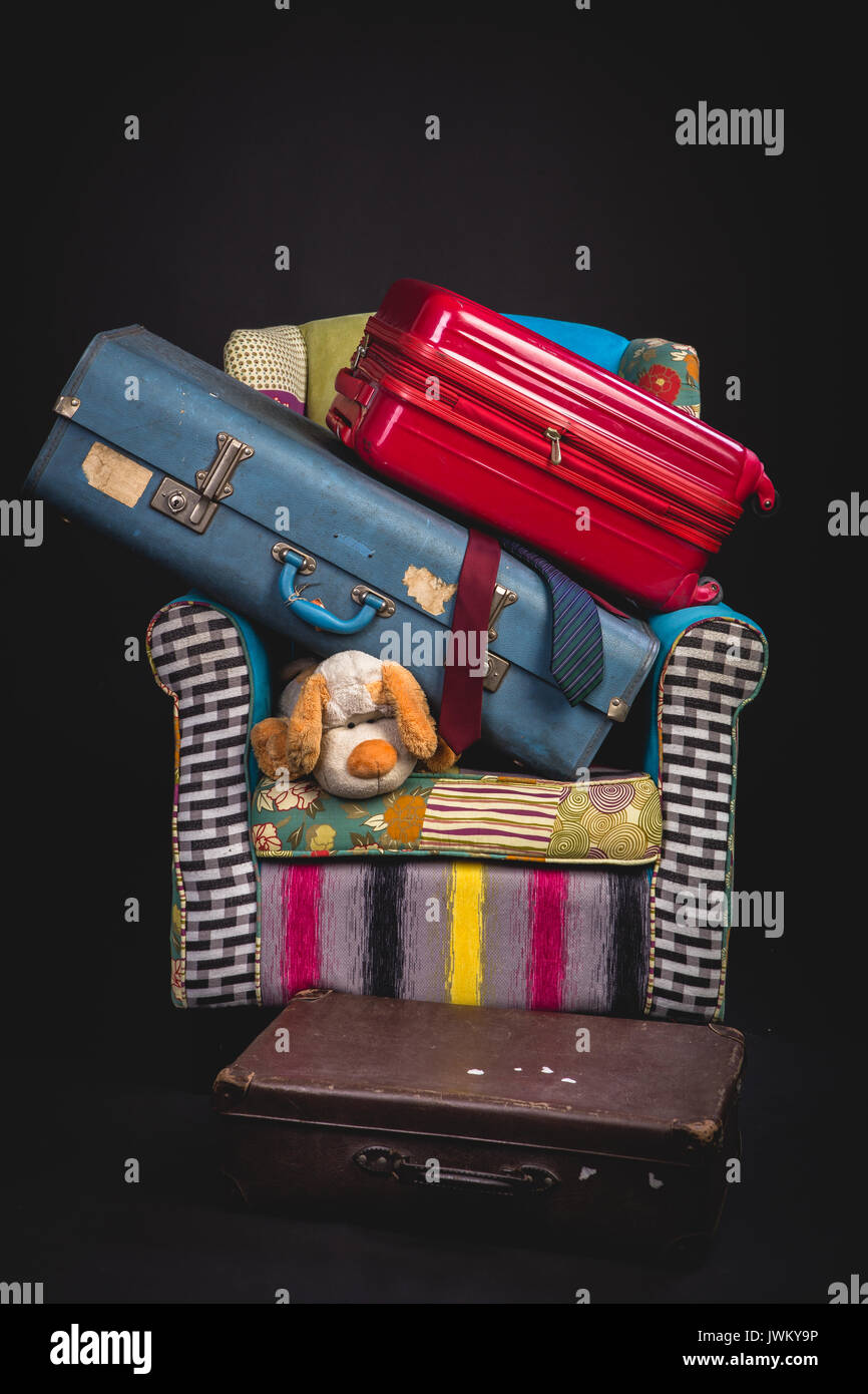 Luggage and Suitcase on Living room chair Stock Photo - Alamy