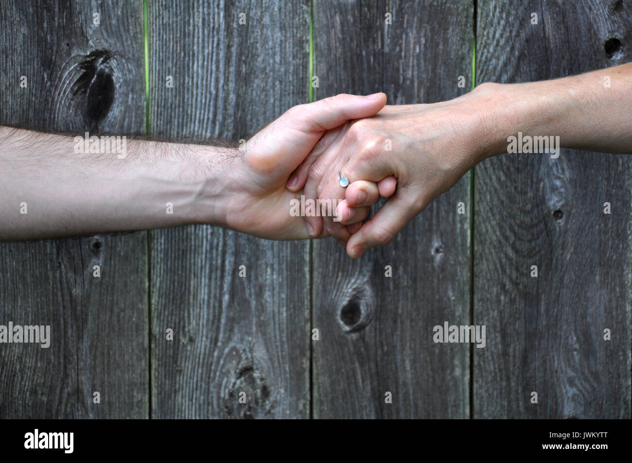 Clasping hands hi-res stock photography and images - Alamy