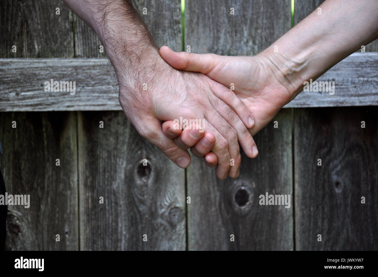 Male hands fence hi-res stock photography and images - Alamy