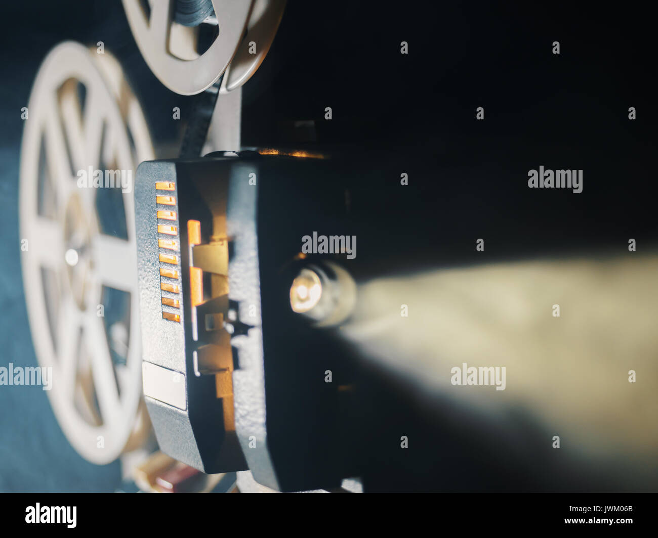 film projector on a black background with dramatic lighting and ...