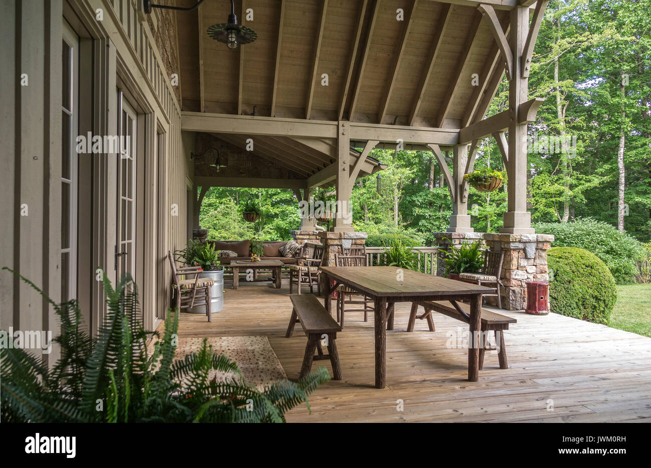 Elegant rustic covered wooden porch on estate home Stock Photo - Alamy