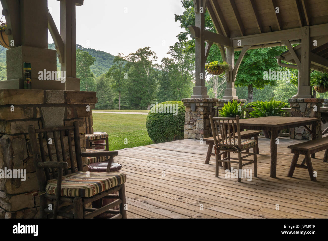 Elegant rustic covered wooden porch on estate home Stock Photo - Alamy