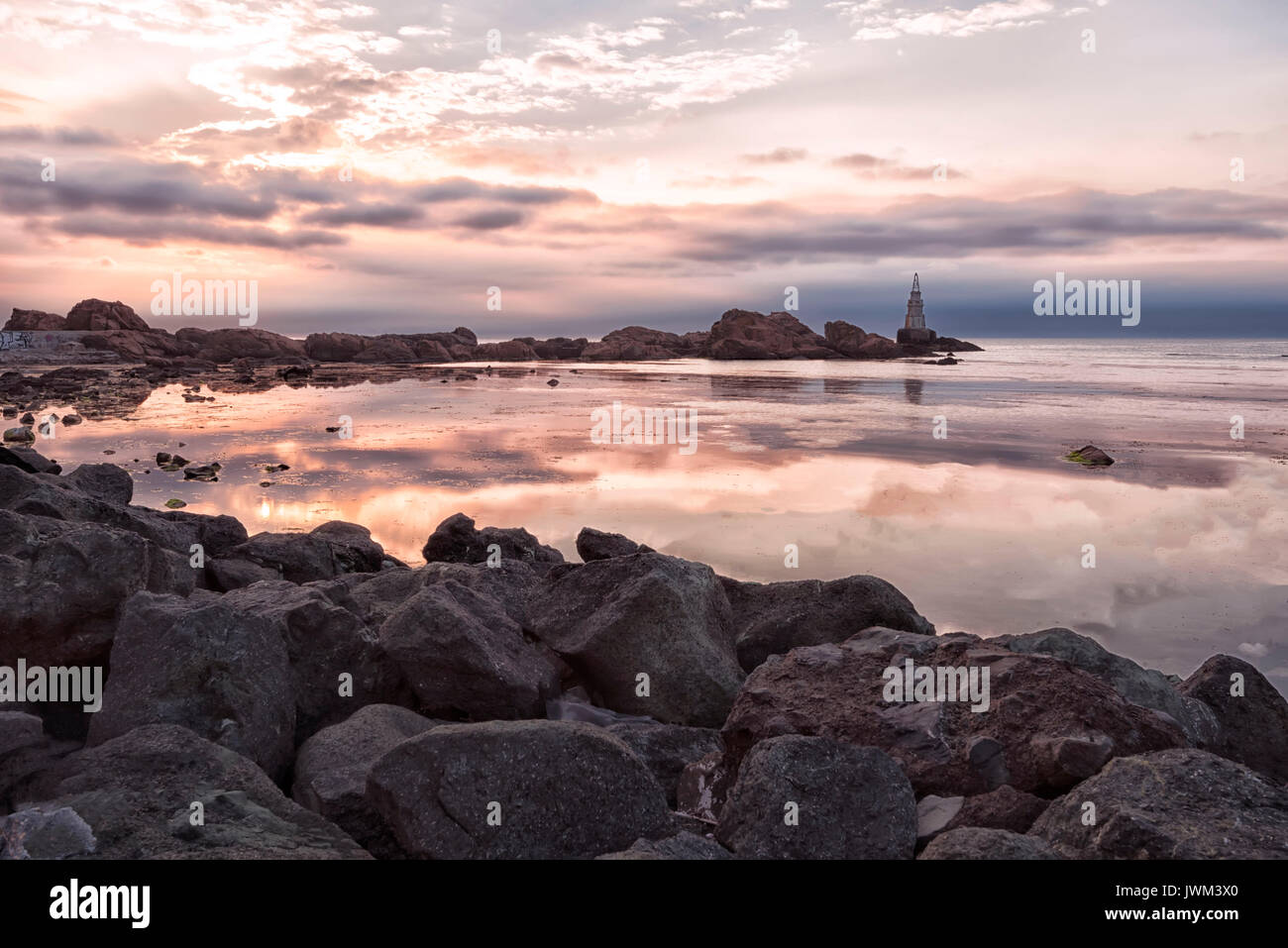 Sunrise of the lighthouse in Ahtopol, Bulgaria. Sea and rocks Stock ...