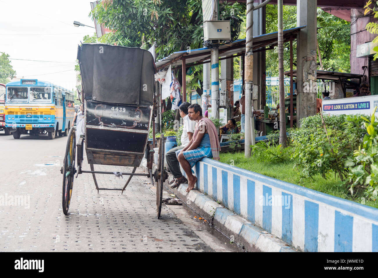 a manual rickshaw puller in Kolkata, India Stock Photo - Alamy
