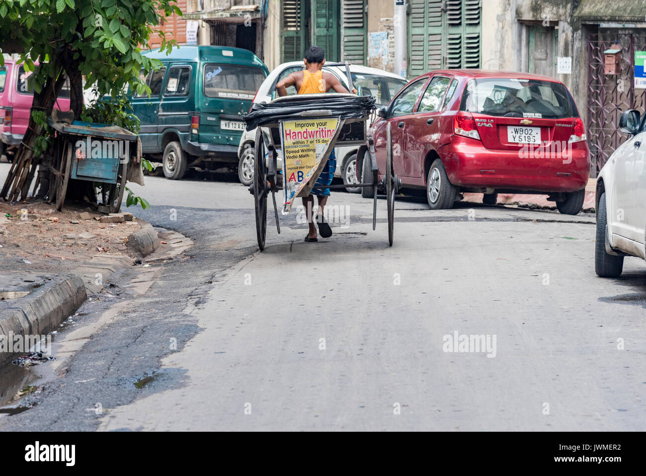 a manual rickshaw puller in Kolkata, India Stock Photo - Alamy