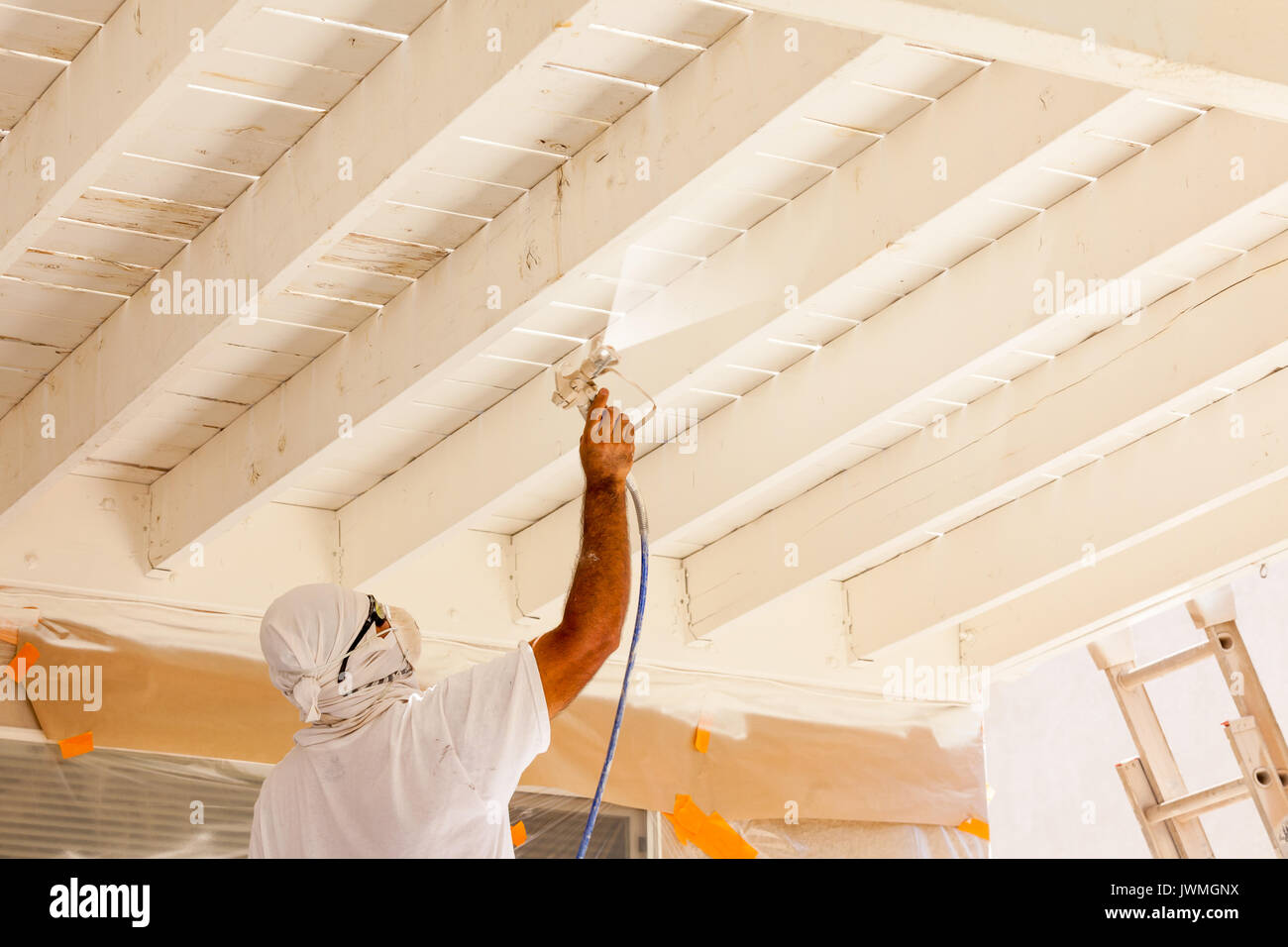 Professional House Painter Wearing Facial Protection Spray Painting ...