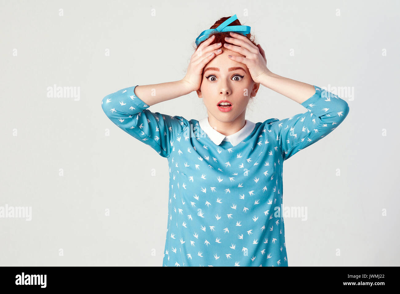 Human face expressions and emotions. Redhead girl looking desperate and ...