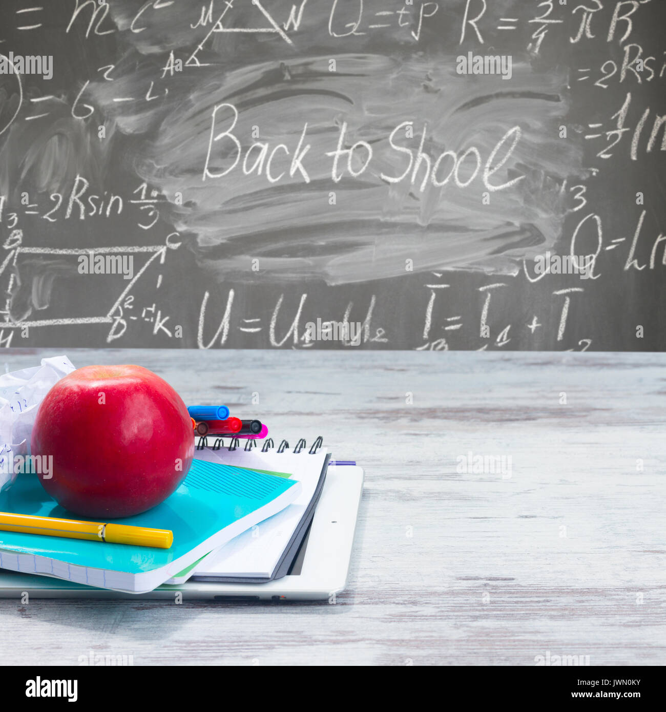 Apple with school supplies Stock Photo - Alamy