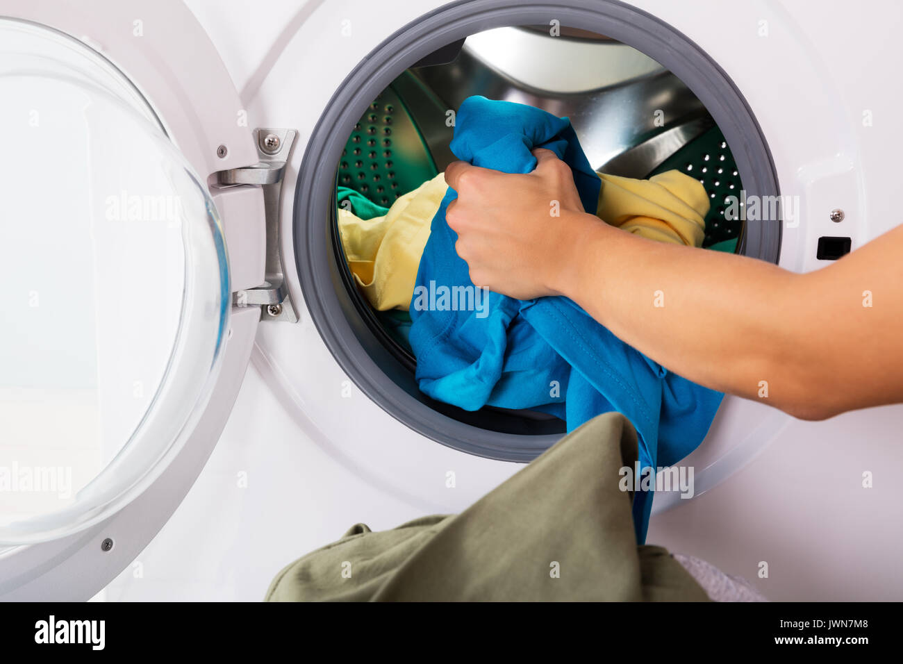Women hand washing clothes hi-res stock photography and images - Alamy