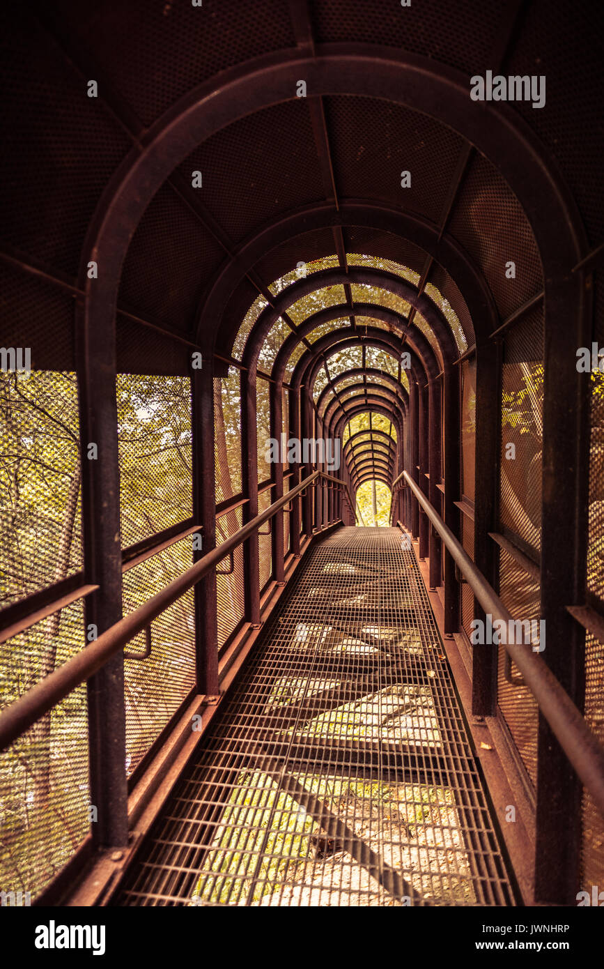 First person perspective view looking down walkway for rusty iron ...