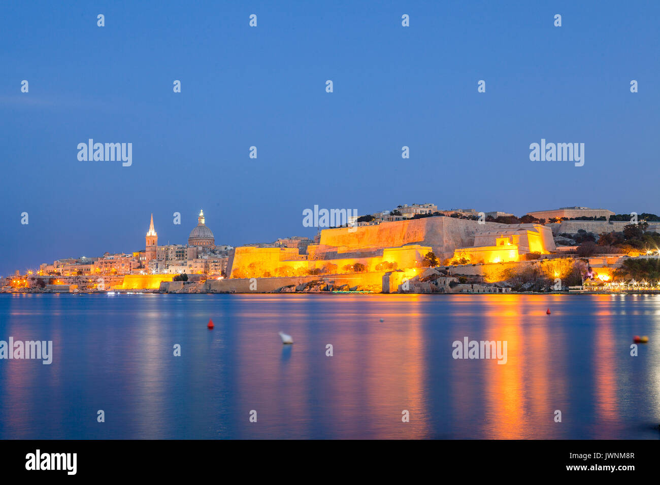 Summer night view of Valetta profile over sea. Long exposure ...