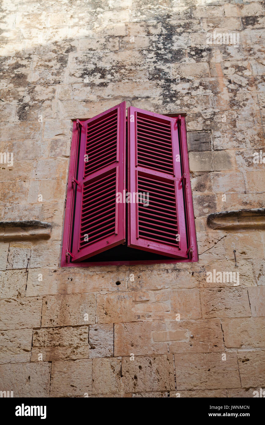 Wooden pink window with shutters in Mdina old town, Malta Stock Photo ...