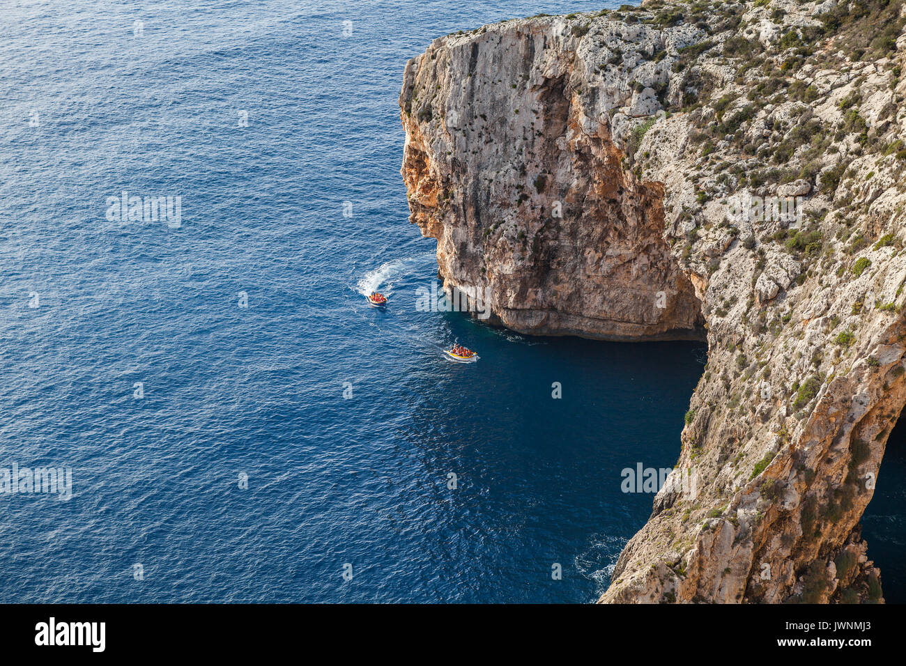Boat trip around the Blue grotto in Malta Stock Photo - Alamy