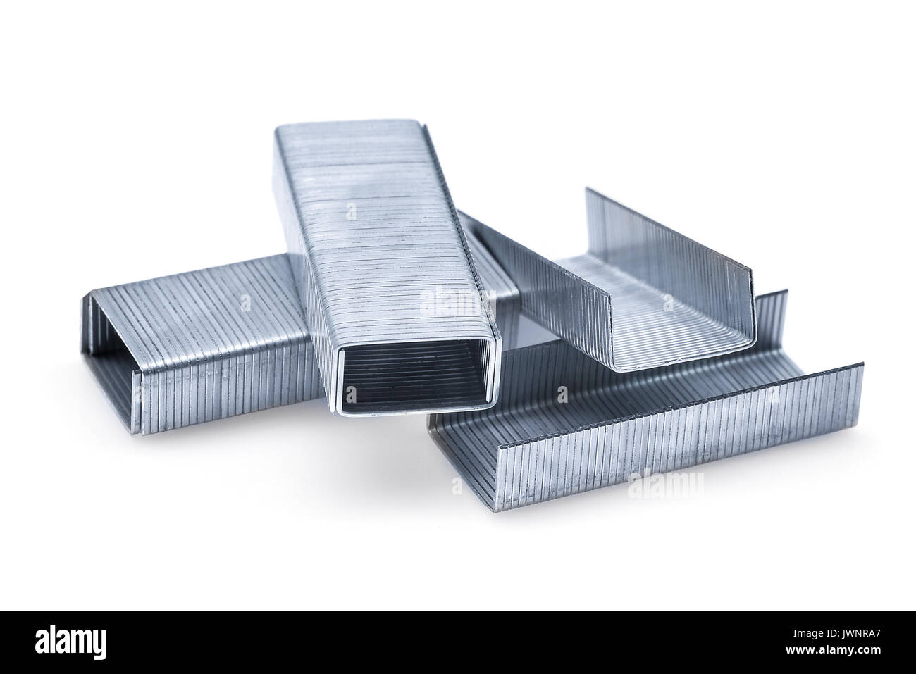 pile of metal staples isolated on white background Stock Photo - Alamy