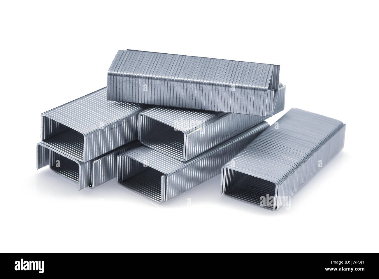 pile of metal staples isolated on white background Stock Photo - Alamy