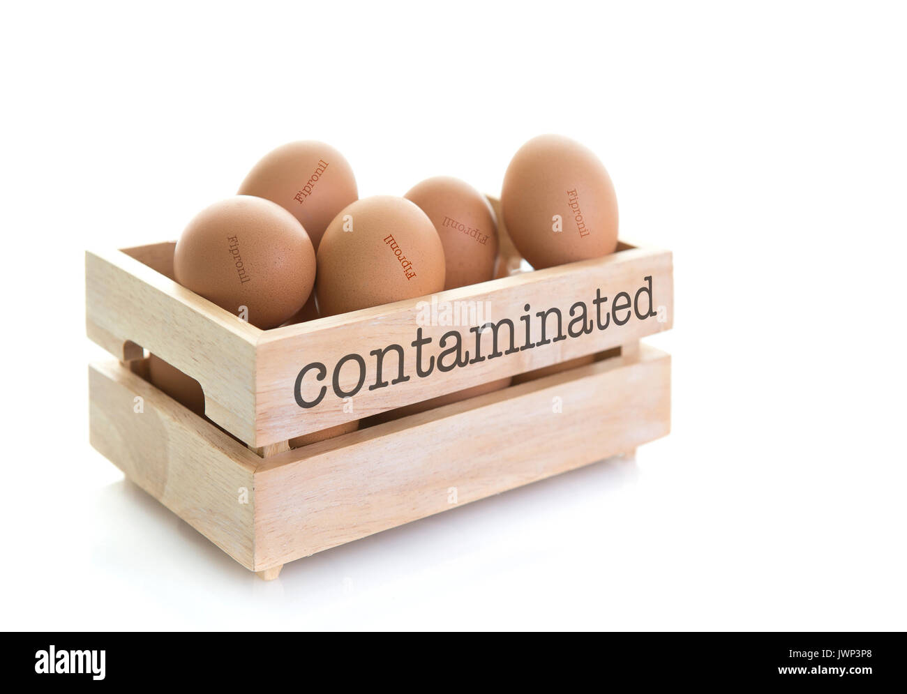 Wooden Egg Box full of Fipronil contaminated eggs on a white background ...