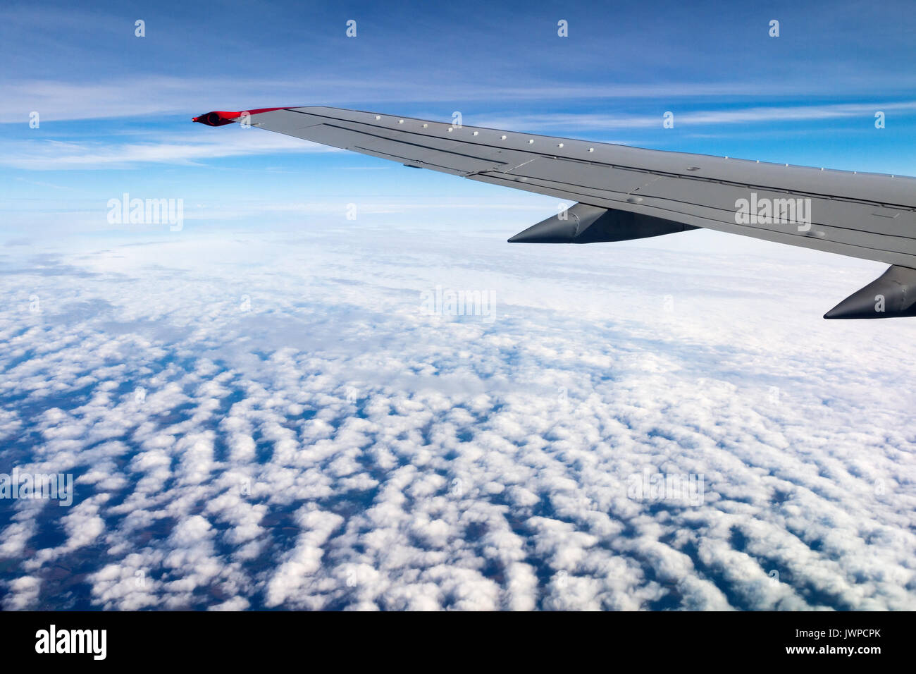 Aerial view out of window of plane which flies above the earth surface ...