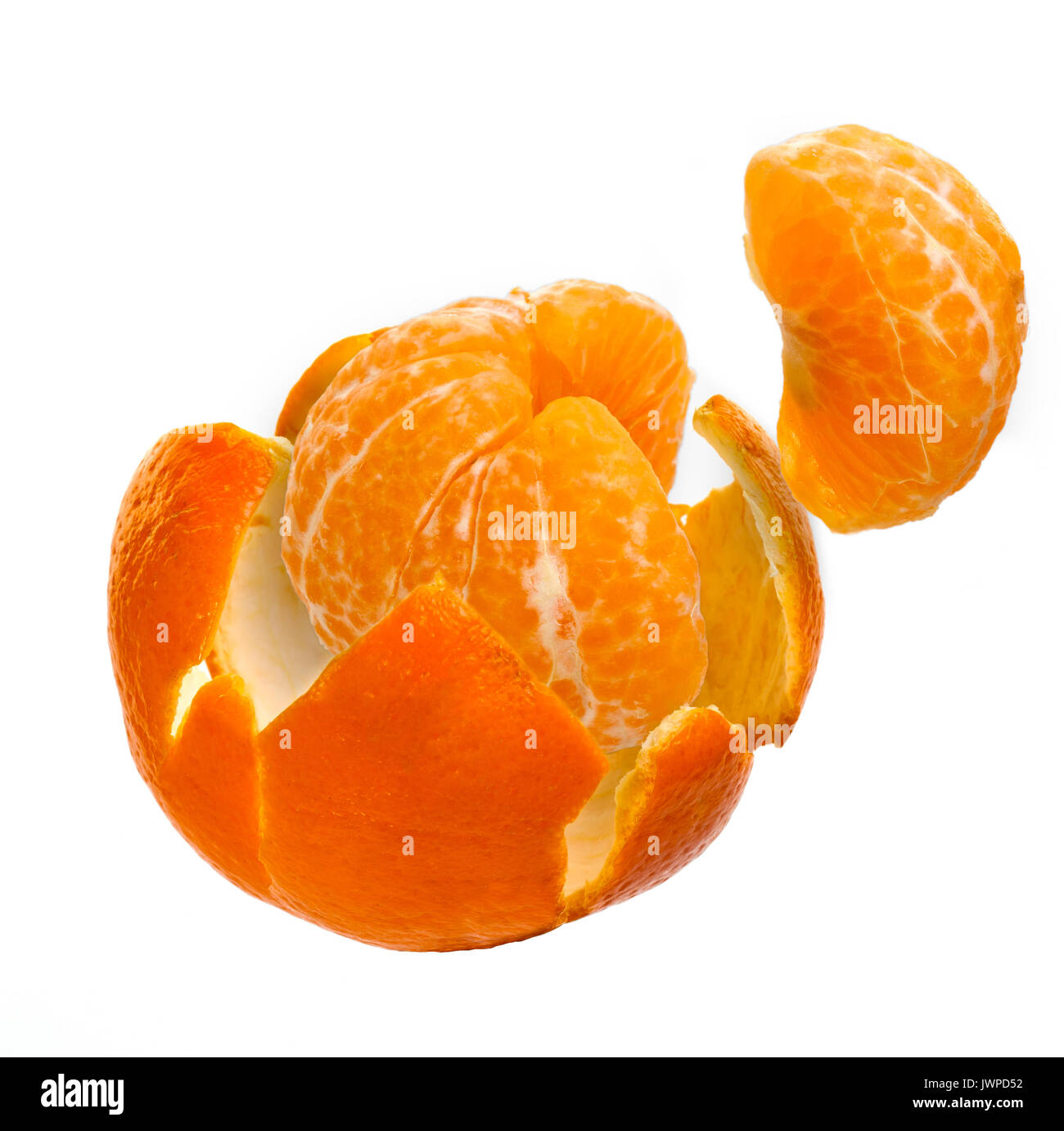 Lovely fresh juicy peeled tangerine with segments lose inside the peel ...