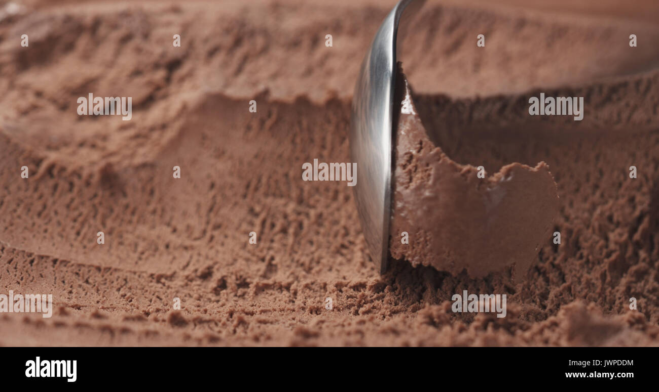 closeup scooping chocolate ice cream with spoon, wide photo Stock Photo ...