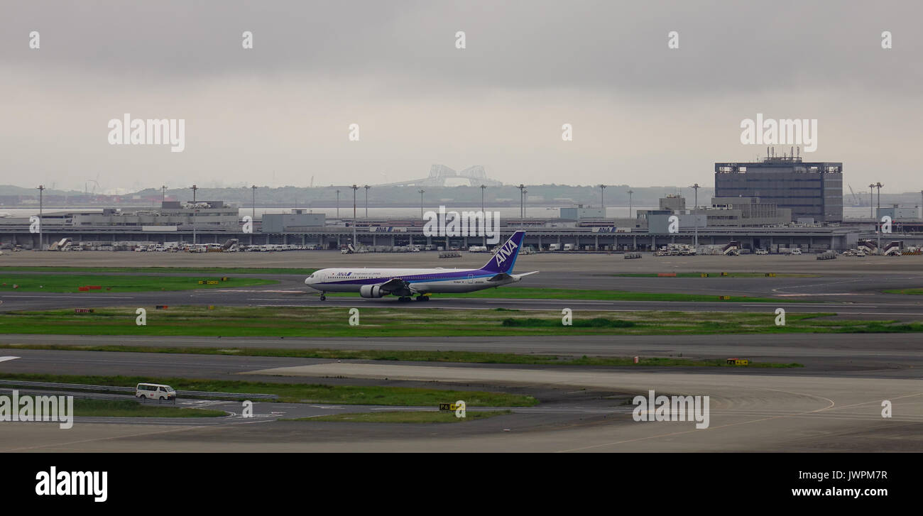 Tokyo, Japan - May 15, 2017. An ANA aircraft on runway at Haneda ...