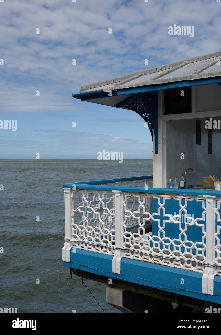 Detail of pier kiosk and cast iron guard railing edge protection on ...