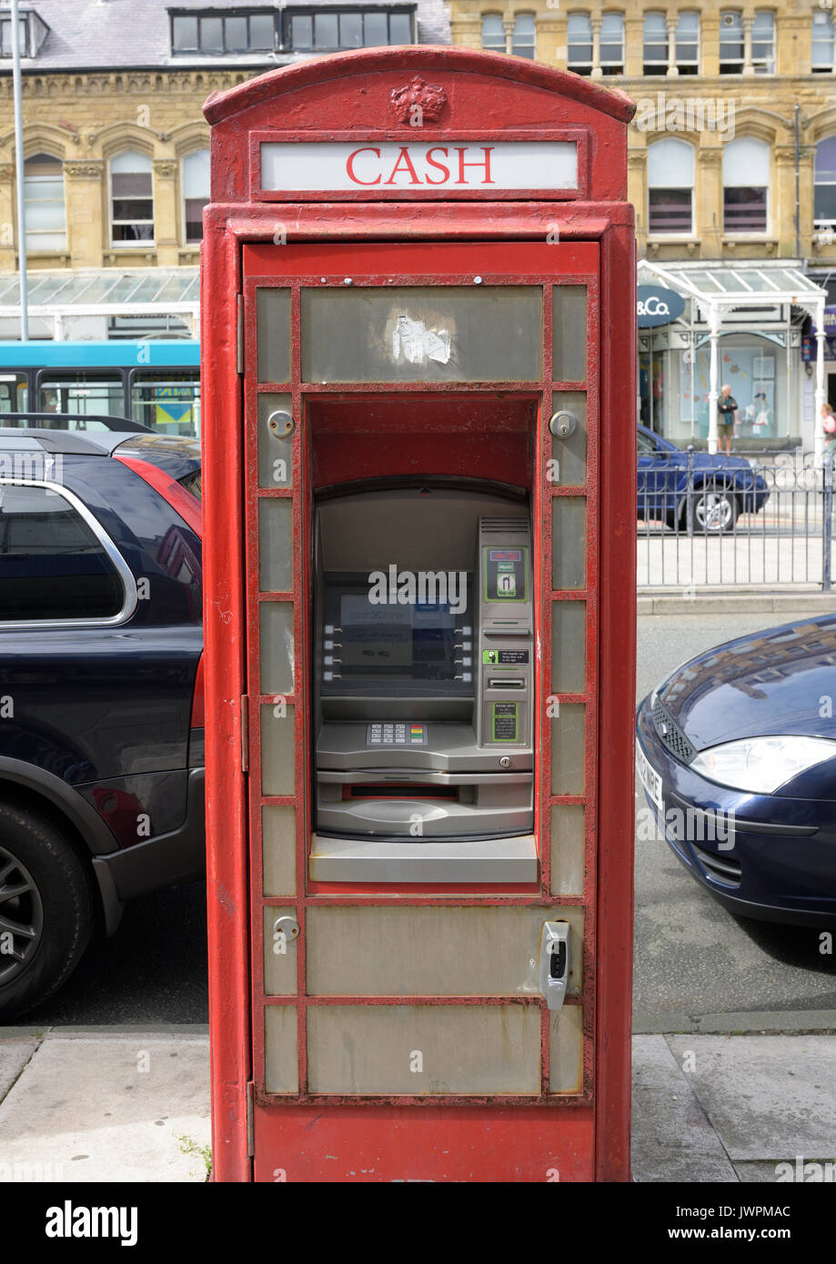 Cash machine built into red telephone kiosk Stock Photo - Alamy