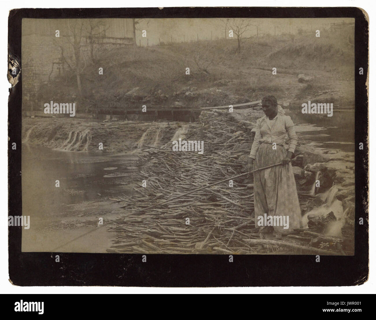 African American woman standing by dam Stock Photo - Alamy
