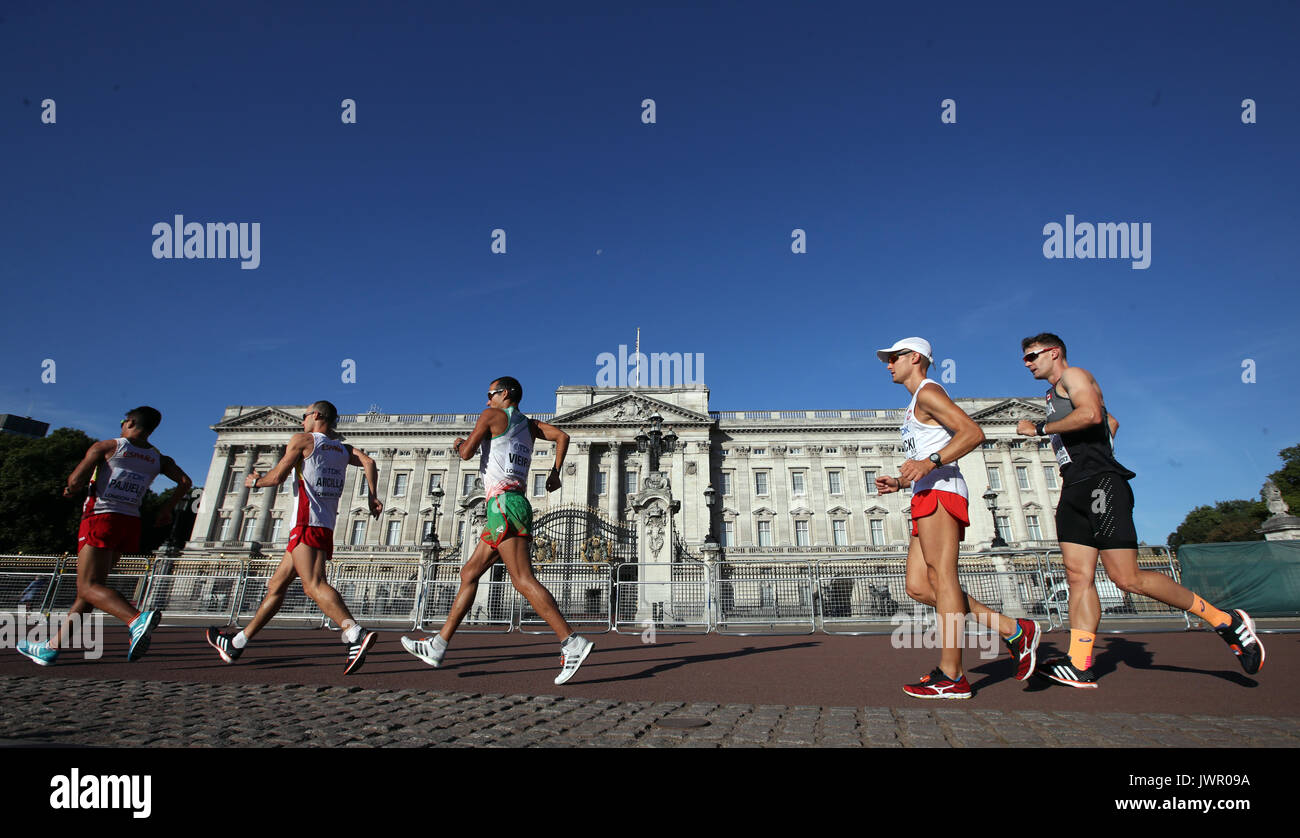 General view of competitors as they pass Buckingham Palace in the Men's ...