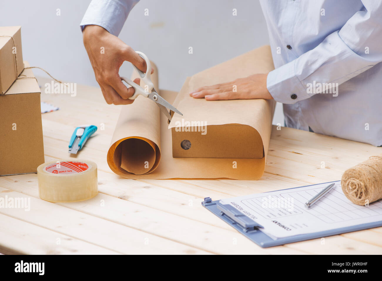 Delivery man packing up on work place in post office Stock Photo - Alamy