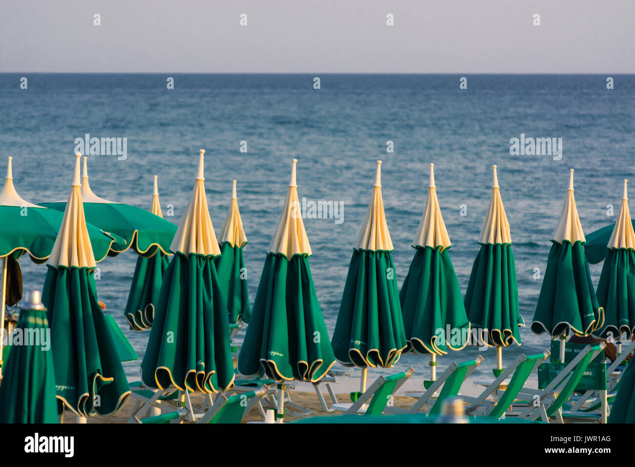 Vacation season - many beach umbrellas on the sea beach, holidays on ...