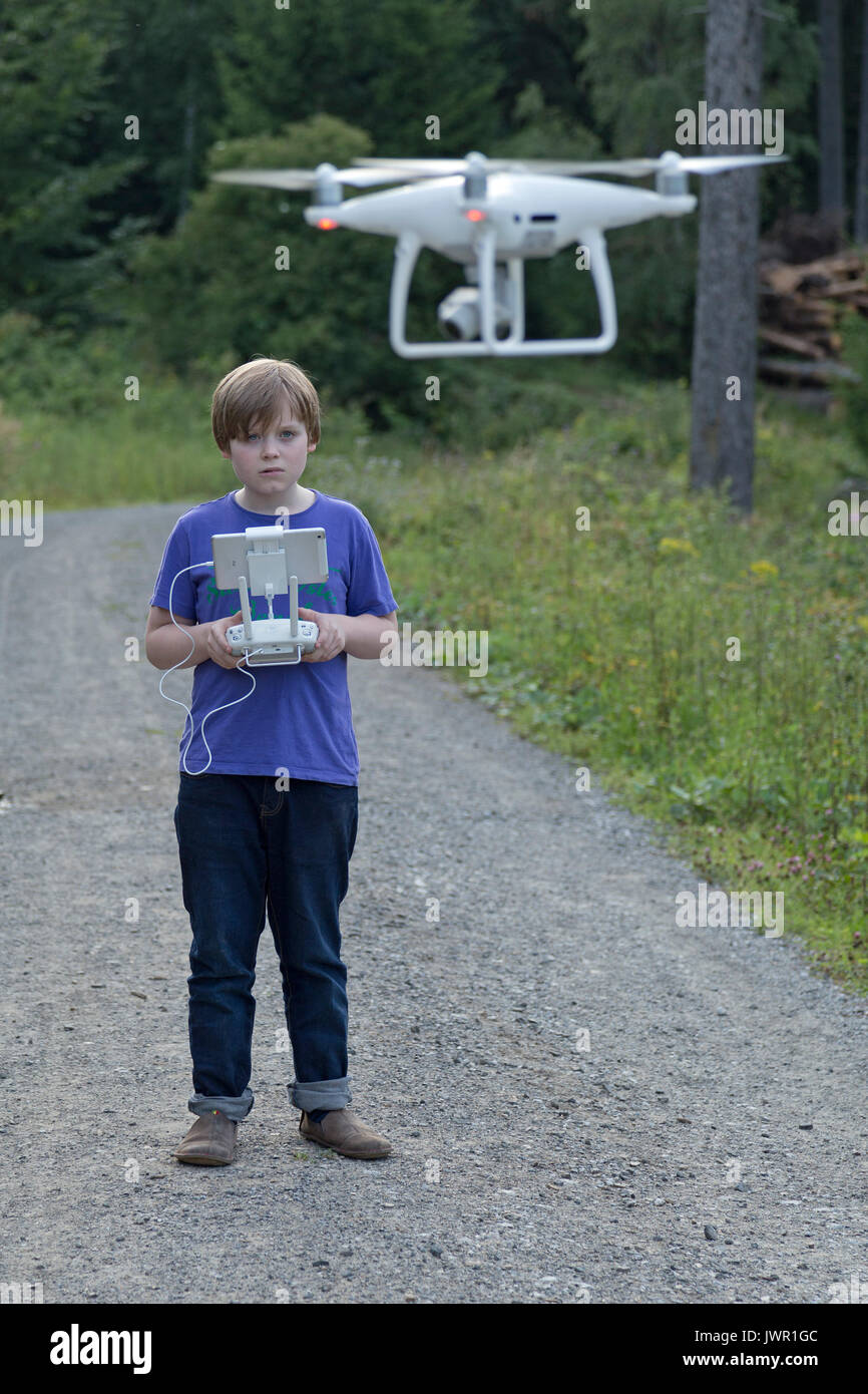 Young boy flying a drone Stock Photo - Alamy